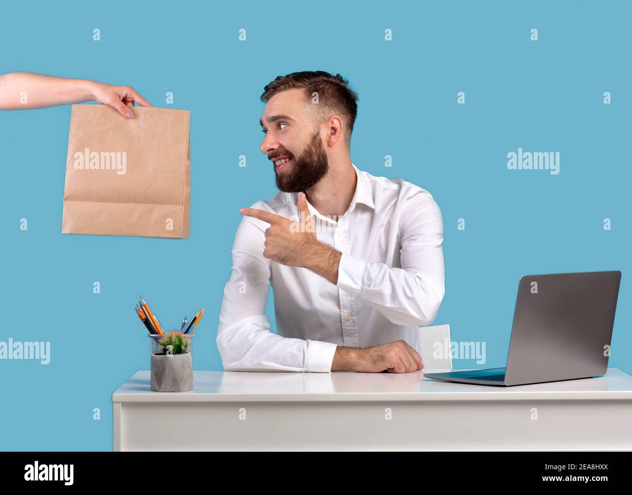 Online food delivery. Happy young guy ordering his takeaway meal to ...