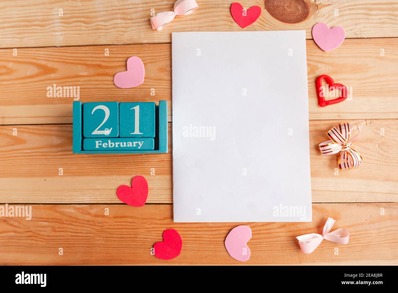 February 21. Blue cube calendar with month and date and white mockup ...