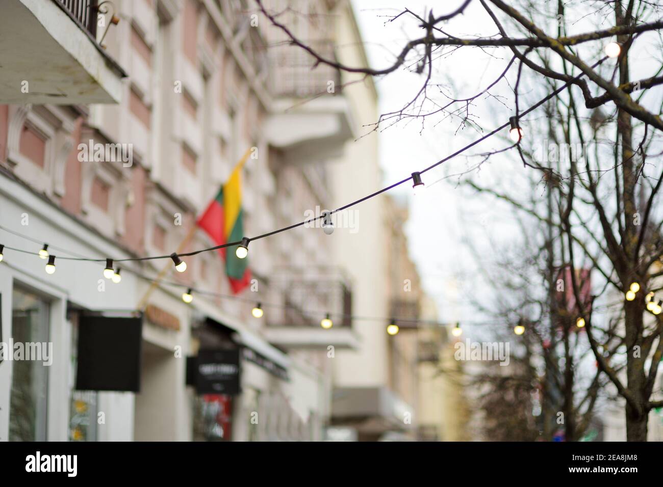 Bulb garland lights decorations on streets of the Old Town of Vilnius ...