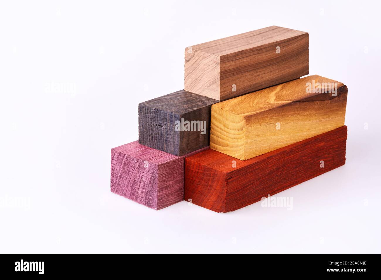 Colored wooden blocks with shavings isolated on white background. It is ...