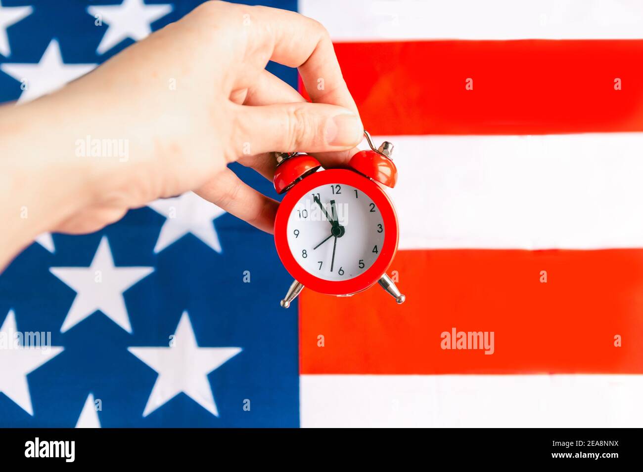 Alarm clock on American flag background. Minimal concept, top view ...