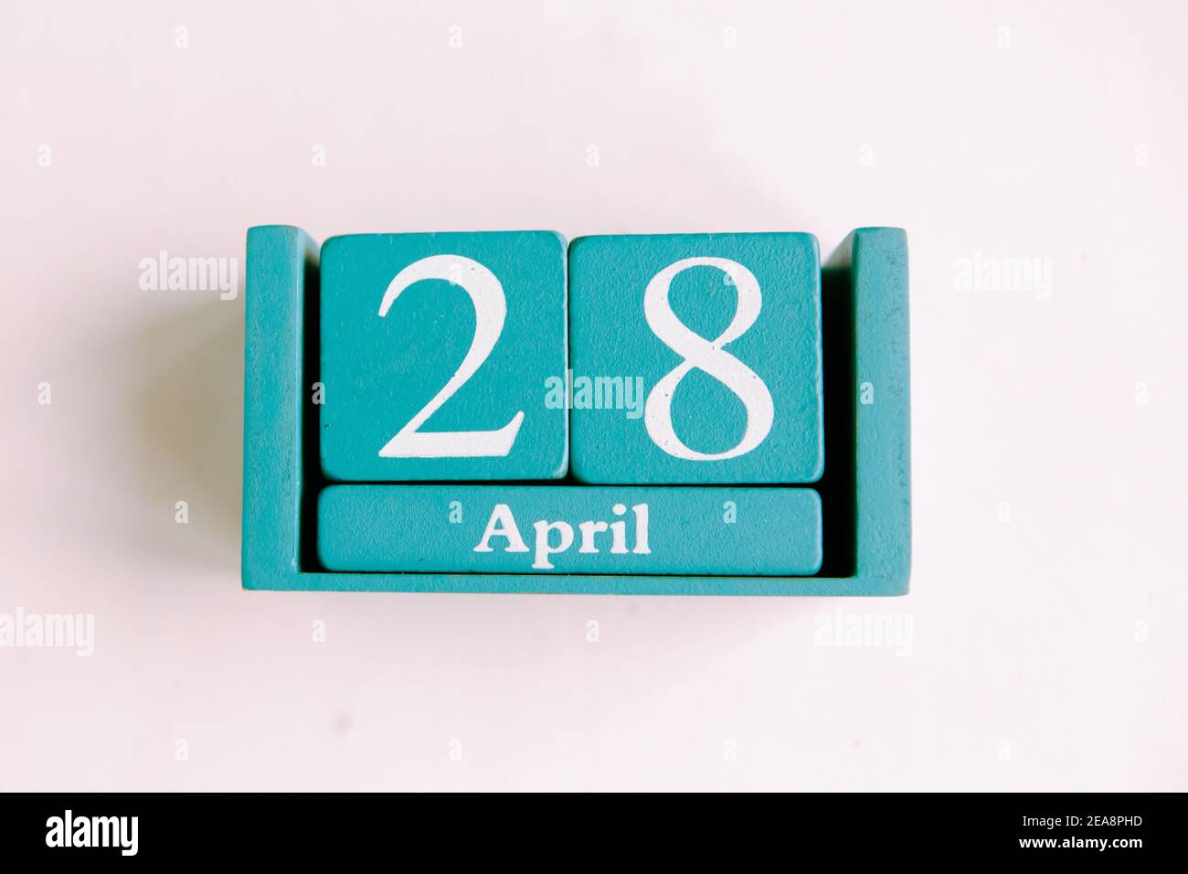 April 28. Blue cube calendar with month date isolated on white ...