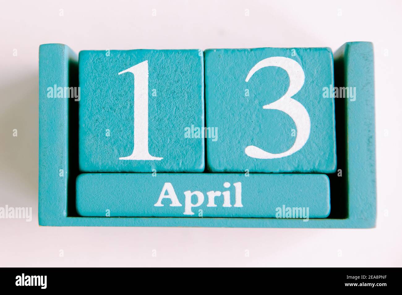 April 13. Blue cube calendar with month date isolated on white ...