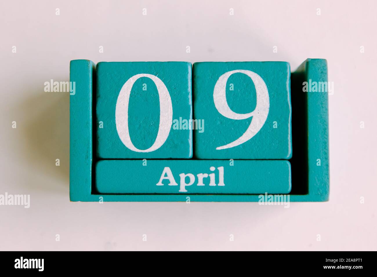 April 9. Blue cube calendar with month date isolated on white ...