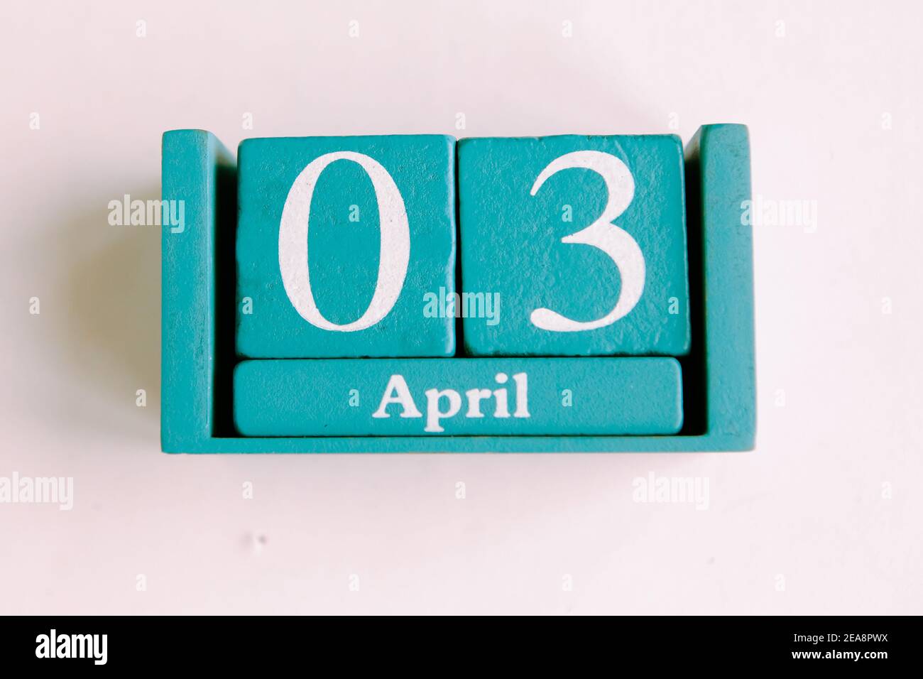 April 3. Blue cube calendar with month date isolated on white ...