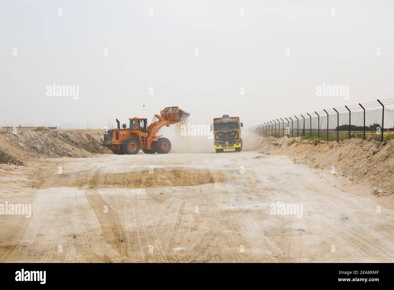 cranes and trucks at work in factory, Jeddah, Saudi Arabia Stock Photo ...