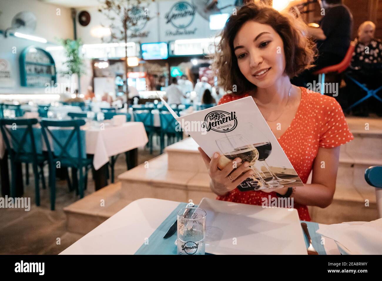 Woman reads menu hi-res stock photography and images - Alamy