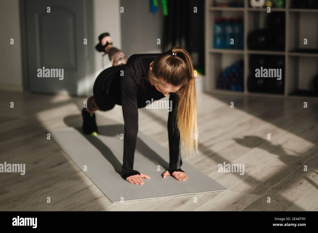 Girl in the gym training, Sport equipment. Athletic female Stock Photo ...