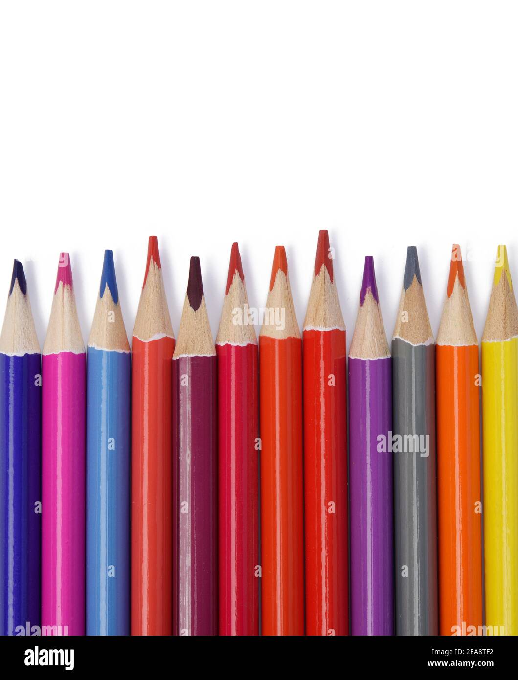 sharpened colored wooden pencils on an white background, top view, set Stock Photo - Alamy