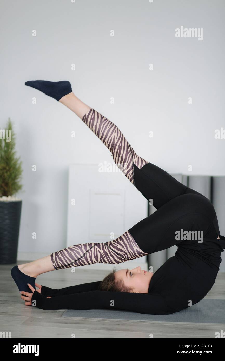Young stretching master show differnt poses for stretch Stock Photo - Alamy
