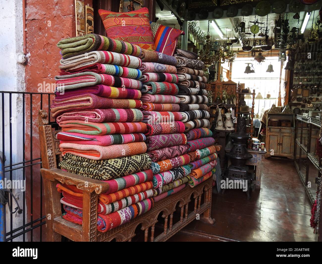 Shop with colorful rugs in Peru Stock Photo - Alamy