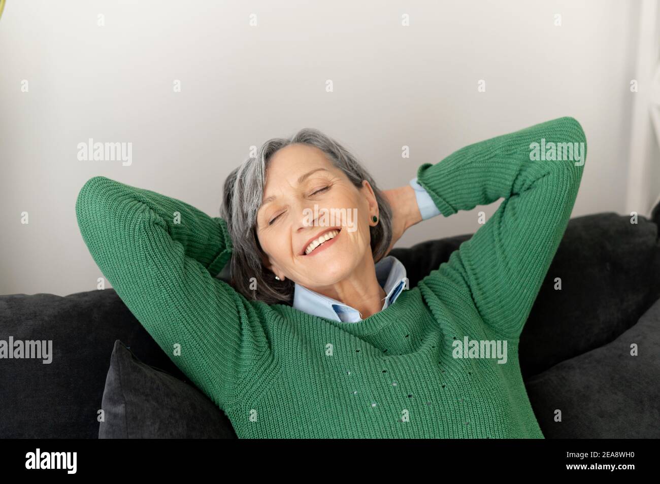 Woman napping mature sofa hi-res stock photography and images - Alamy