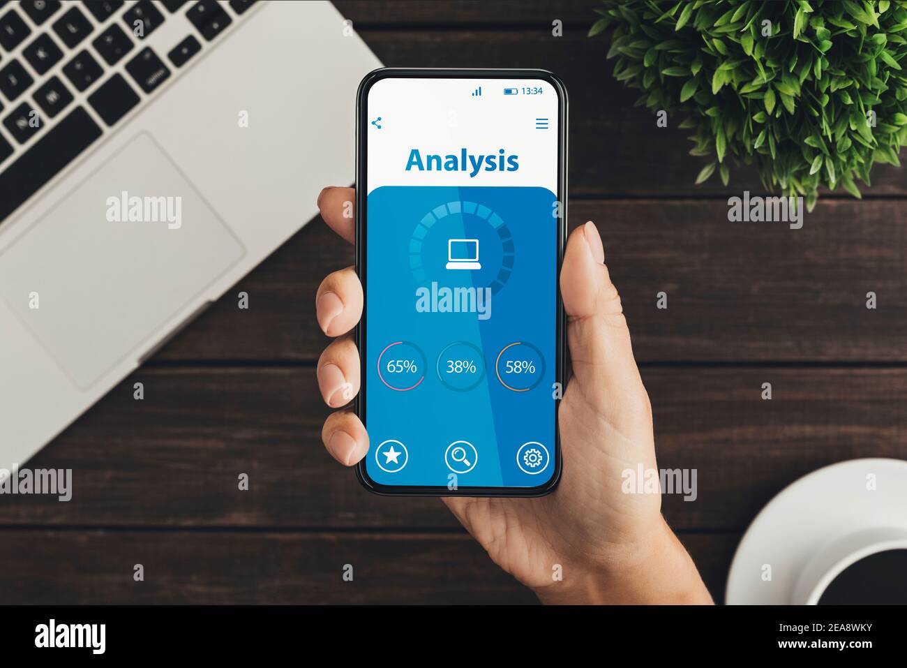 Female Hand Holding Smartphone With Data Analysis App On Screen ...