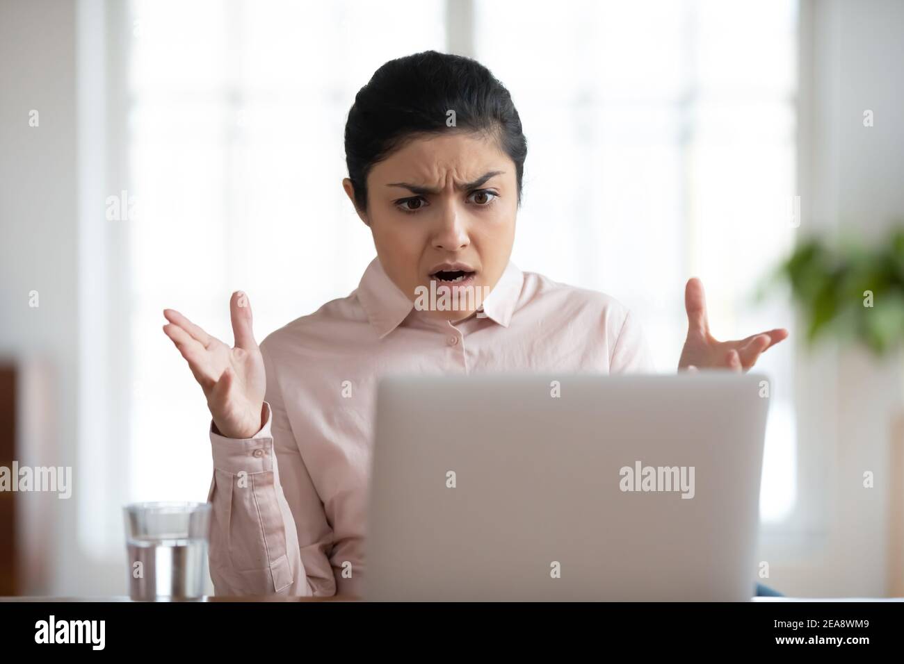 Shocked worried female employee getting unexpected bad news Stock Photo ...