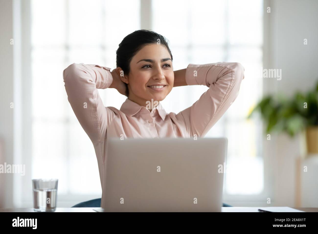 Happy millennial professional satisfied with good job Stock Photo - Alamy
