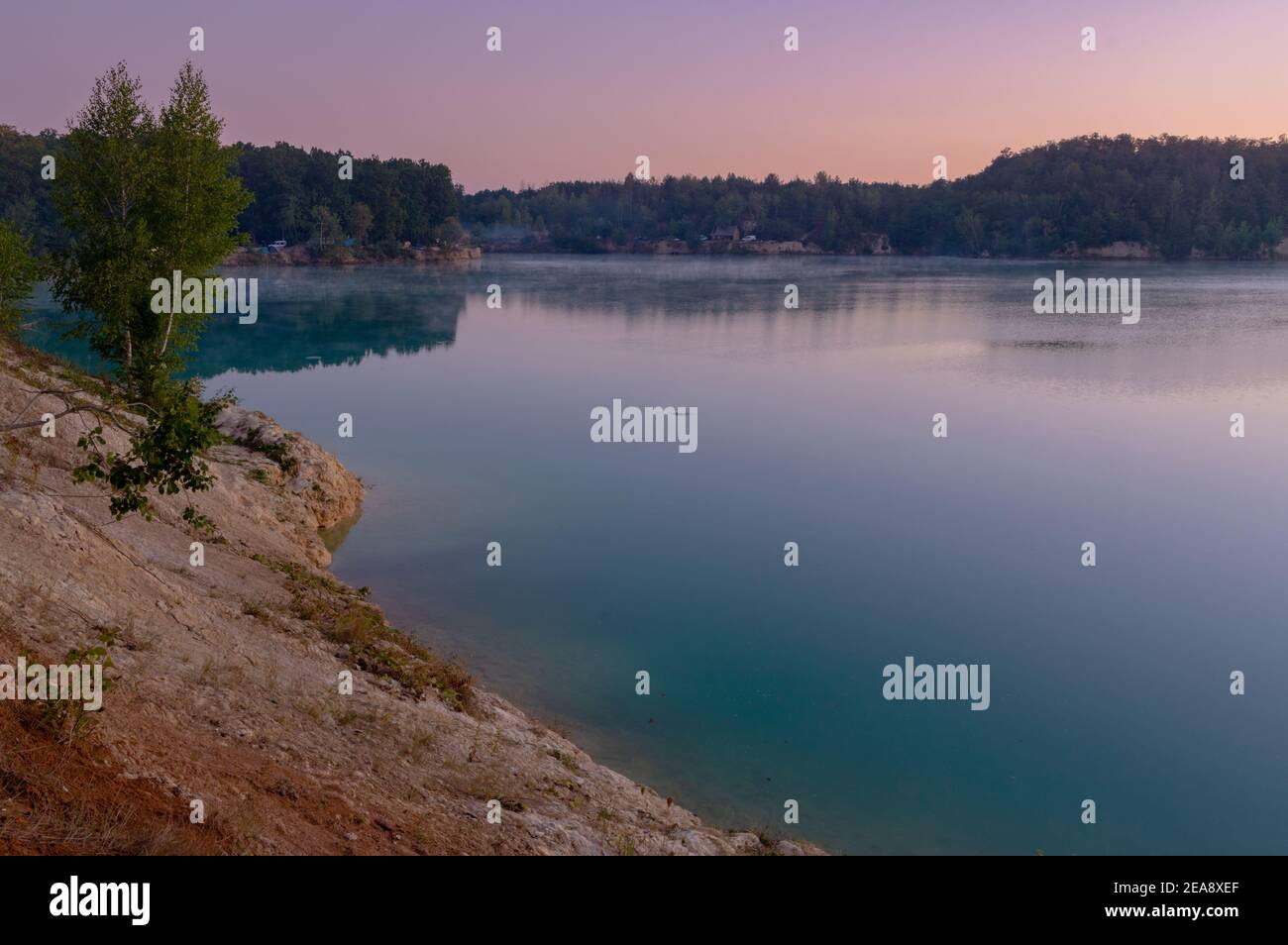 A beautiful turquoise lake. Quarry with turquoise water. Morning Stock ...
