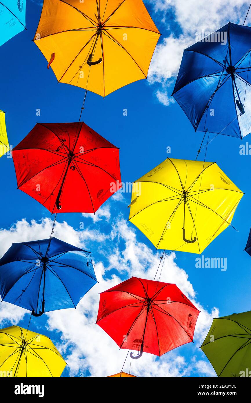 Red floating umbrellas hi-res stock photography and images - Alamy