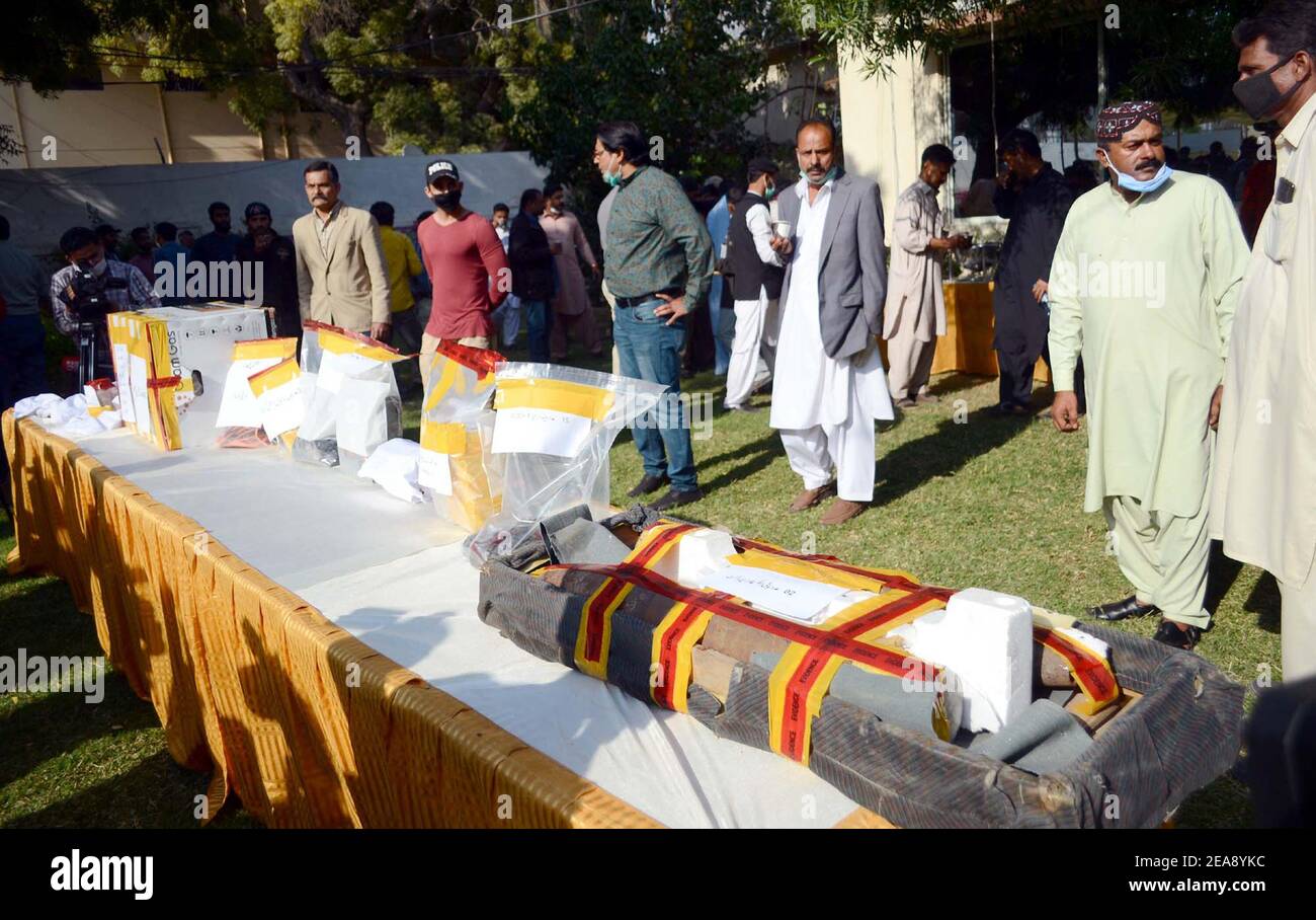 Counter-Terrorism Department (CTD) officials show recovered explosives ...