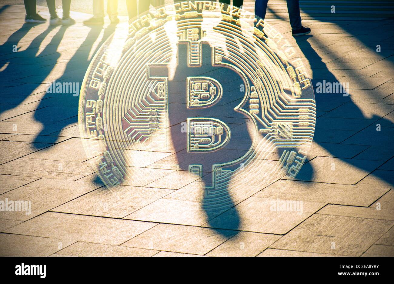 Shadows of people with golden bitcoin symbol, round coin as ...