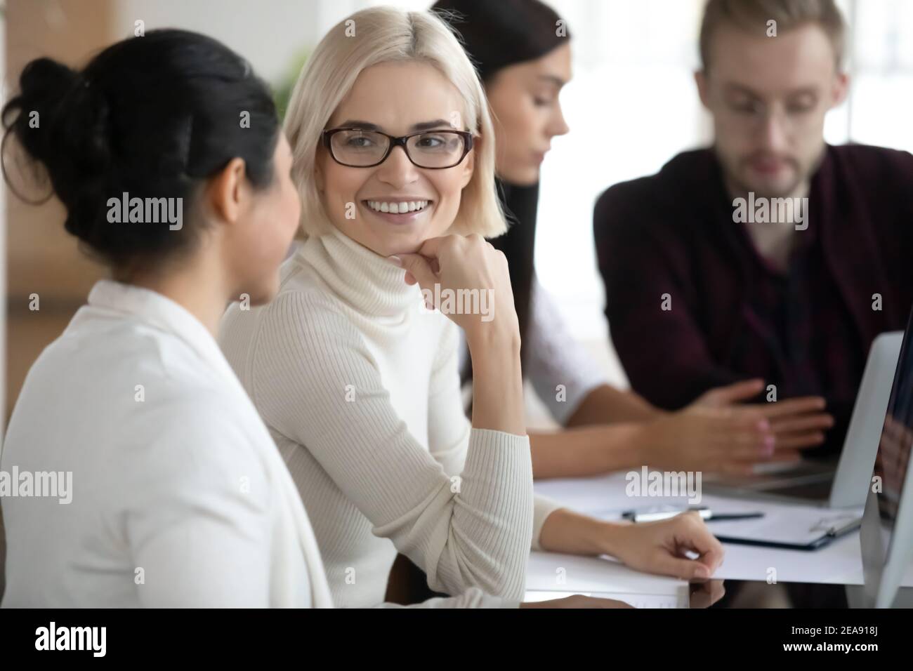 Mentor explaining project task to intern student Stock Photo - Alamy