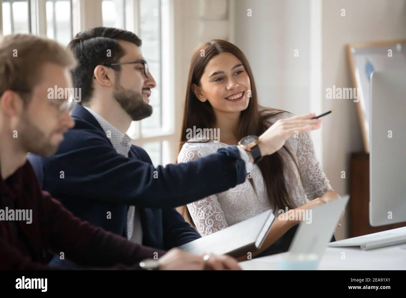 Group young people looking at computer hi-res stock photography and ...