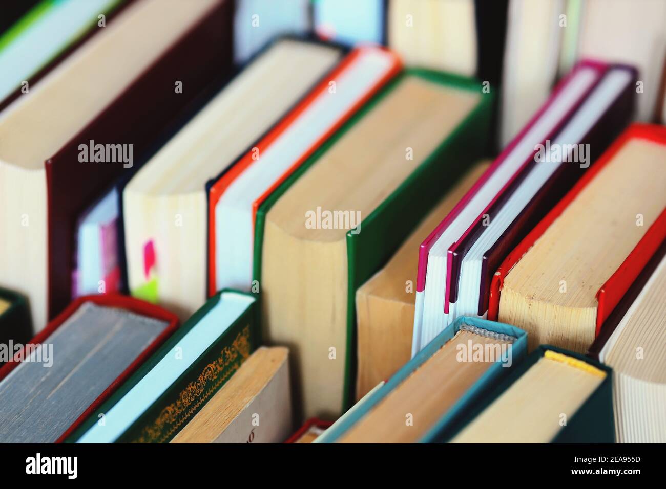 This is a lot of books standing together in several rows. Solid ...