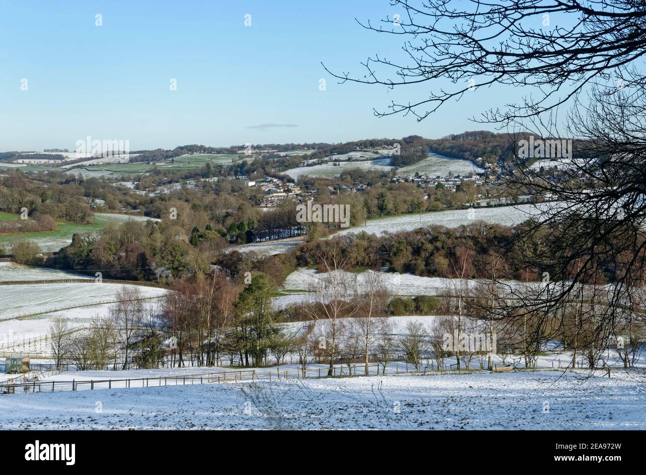 Snow-dusted pastureland, Bybrook Valley and Box village, Wiltshire, UK ...