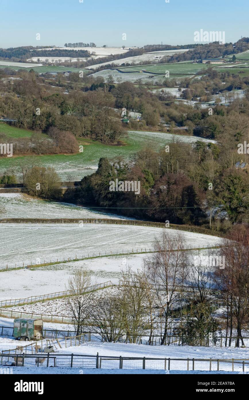 Snow-dusted pastureland and Bybrook Valley, near Box, Wiltshire, UK ...