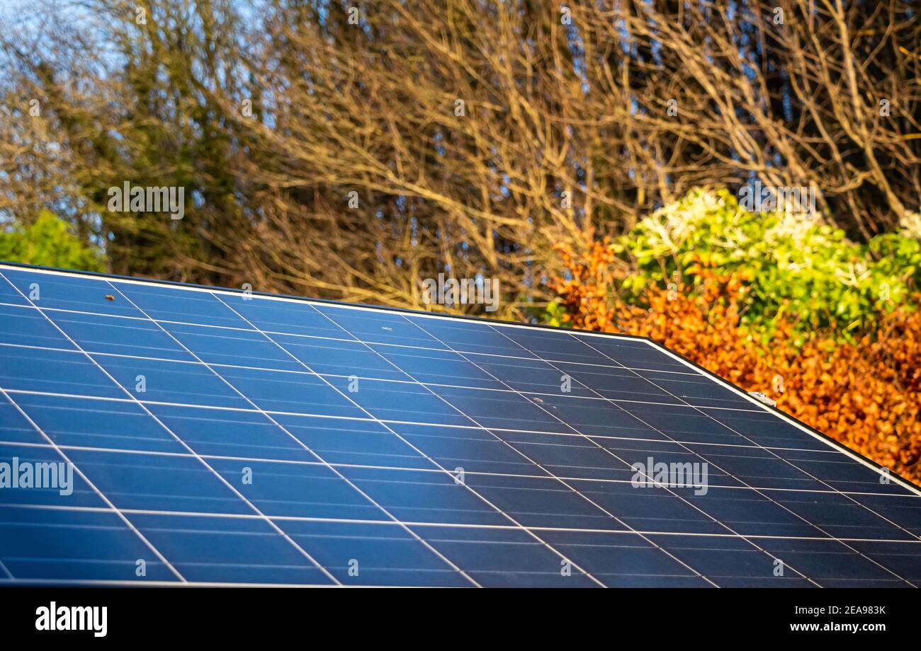 Solar panel generating electricity and fall colours on a sunny day in ...