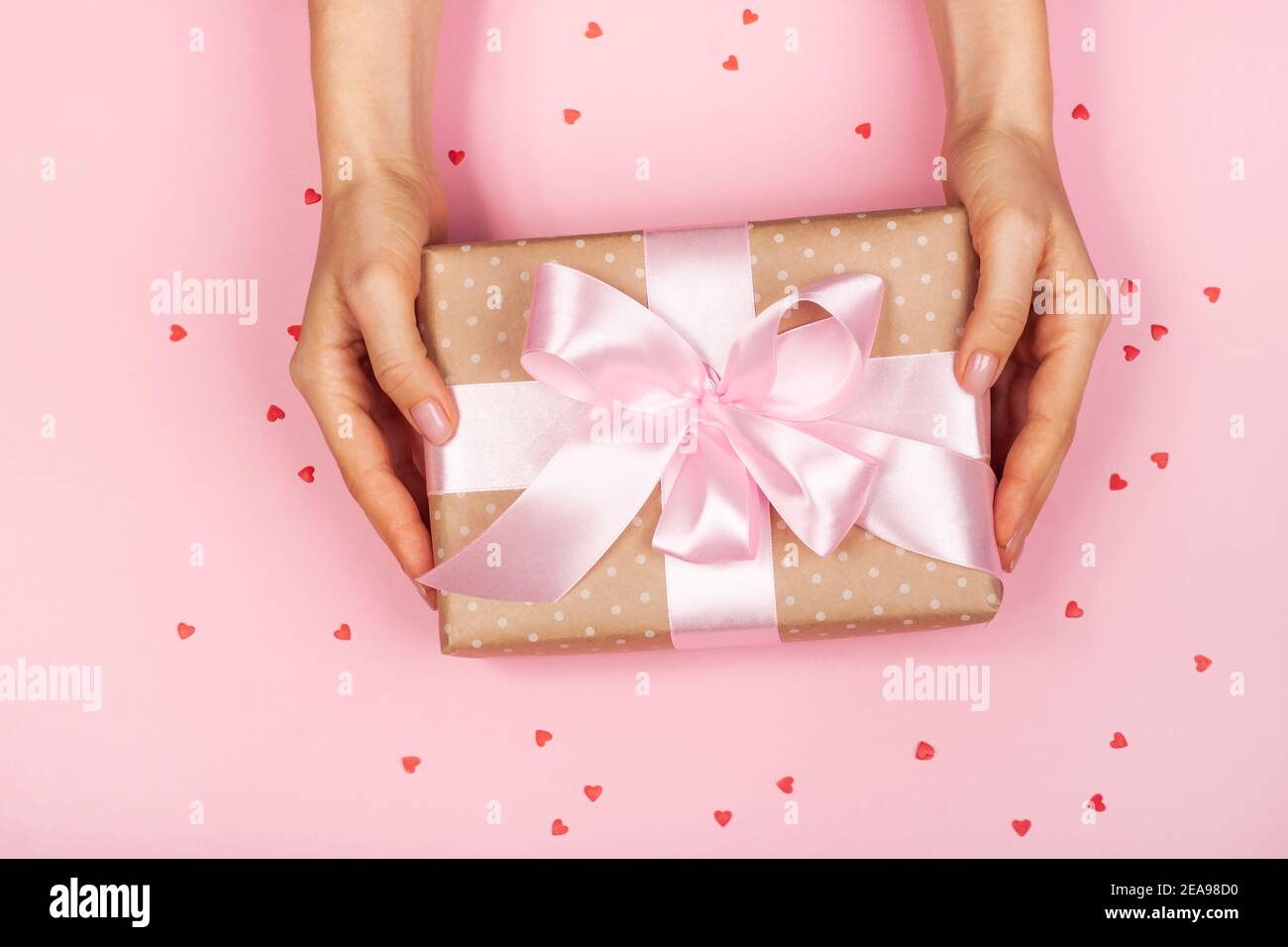 Female hand pink nails holding hi-res stock photography and images - Alamy
