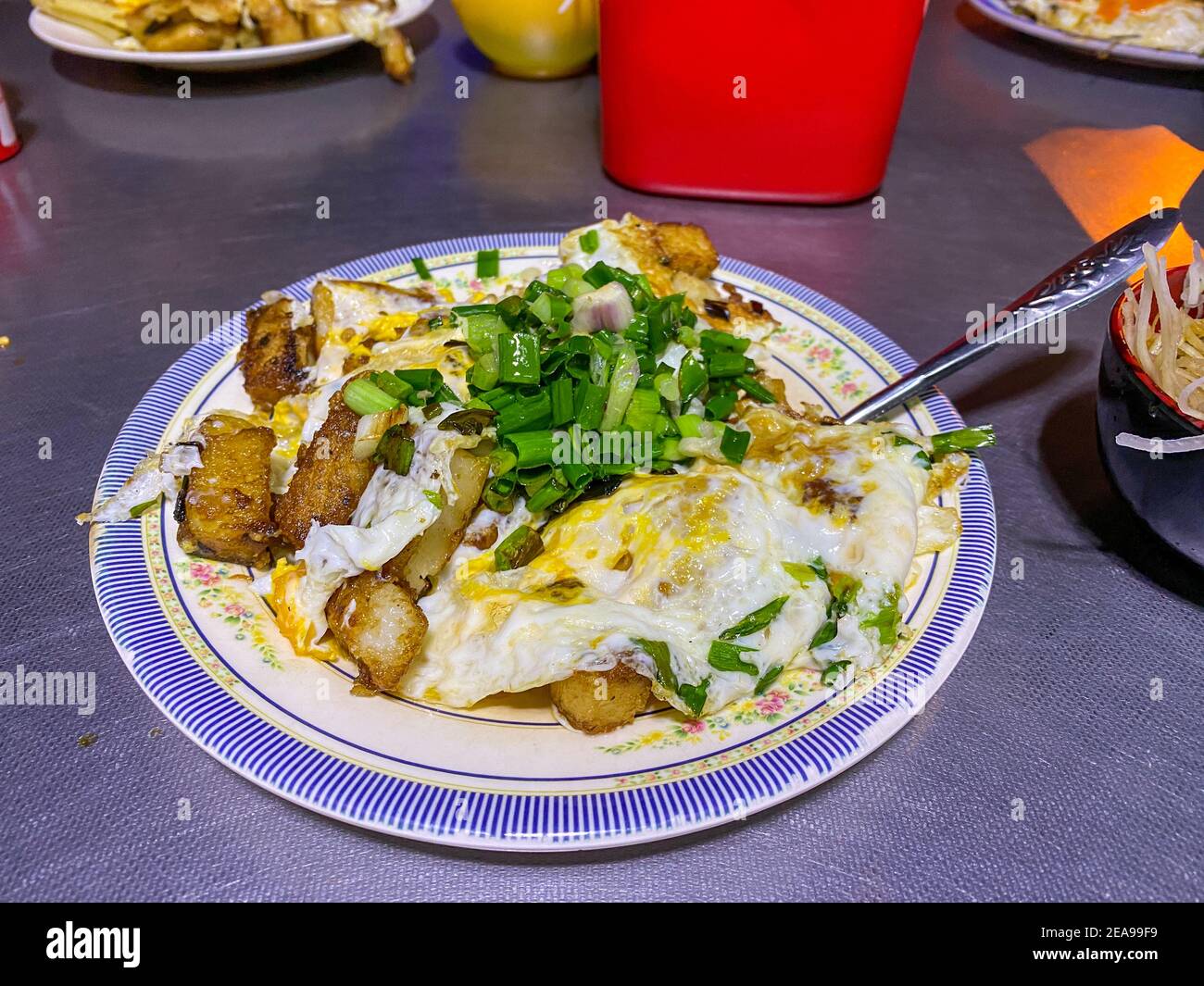 Vietnamese traditional cuisine - Pan-fried rice cake and scrambled egg ...