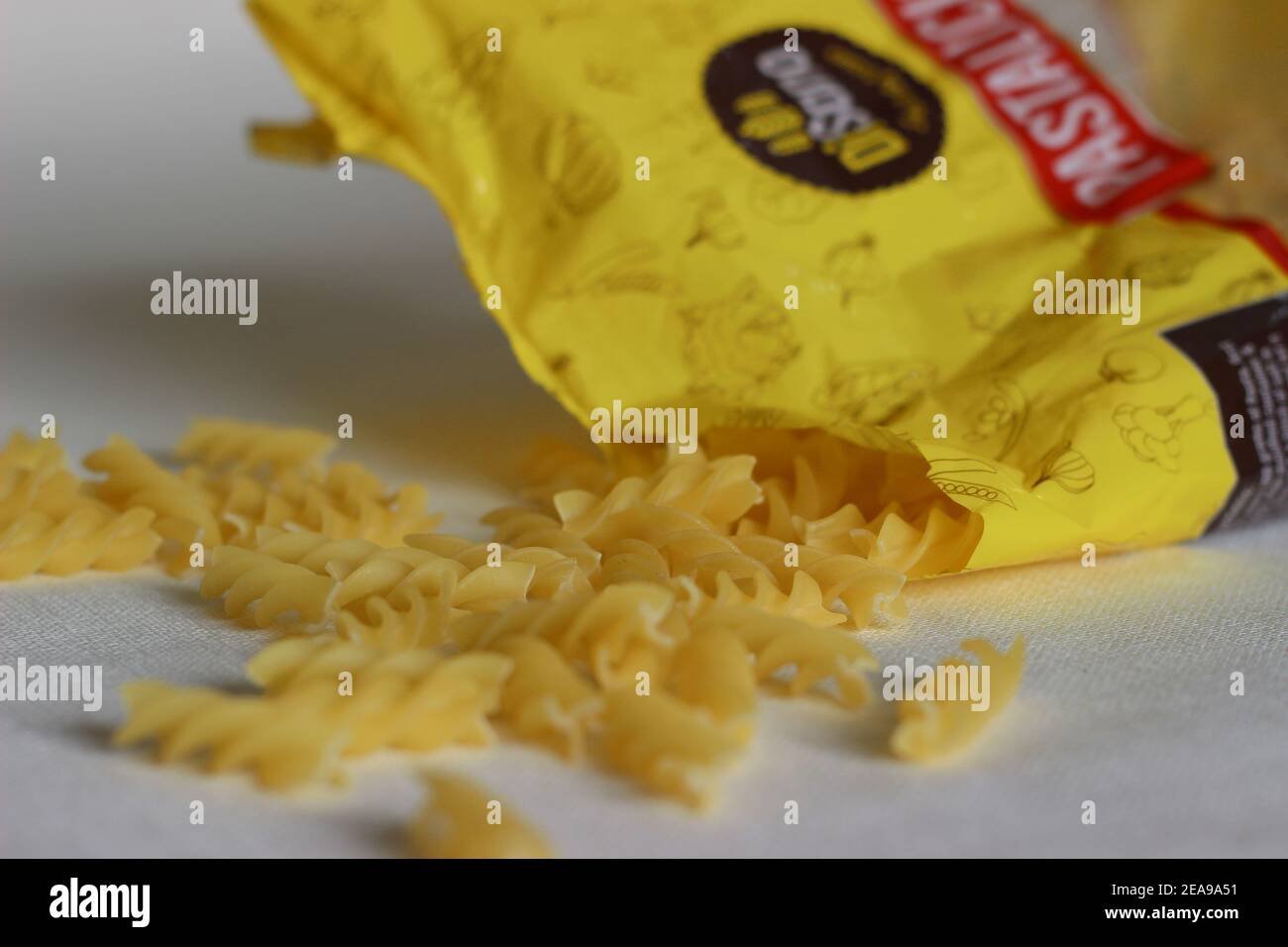 Mumbai, Maharashtra, India, February 08 2021: Fusilli pasta spreading ...