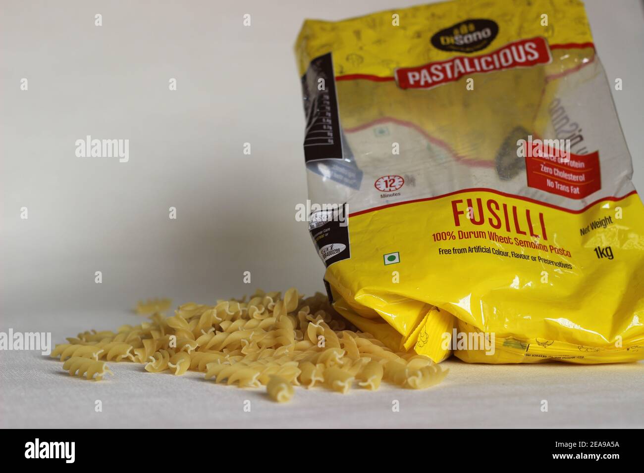 Mumbai, Maharashtra, India, February 08 2021: Fusilli pasta spreading ...