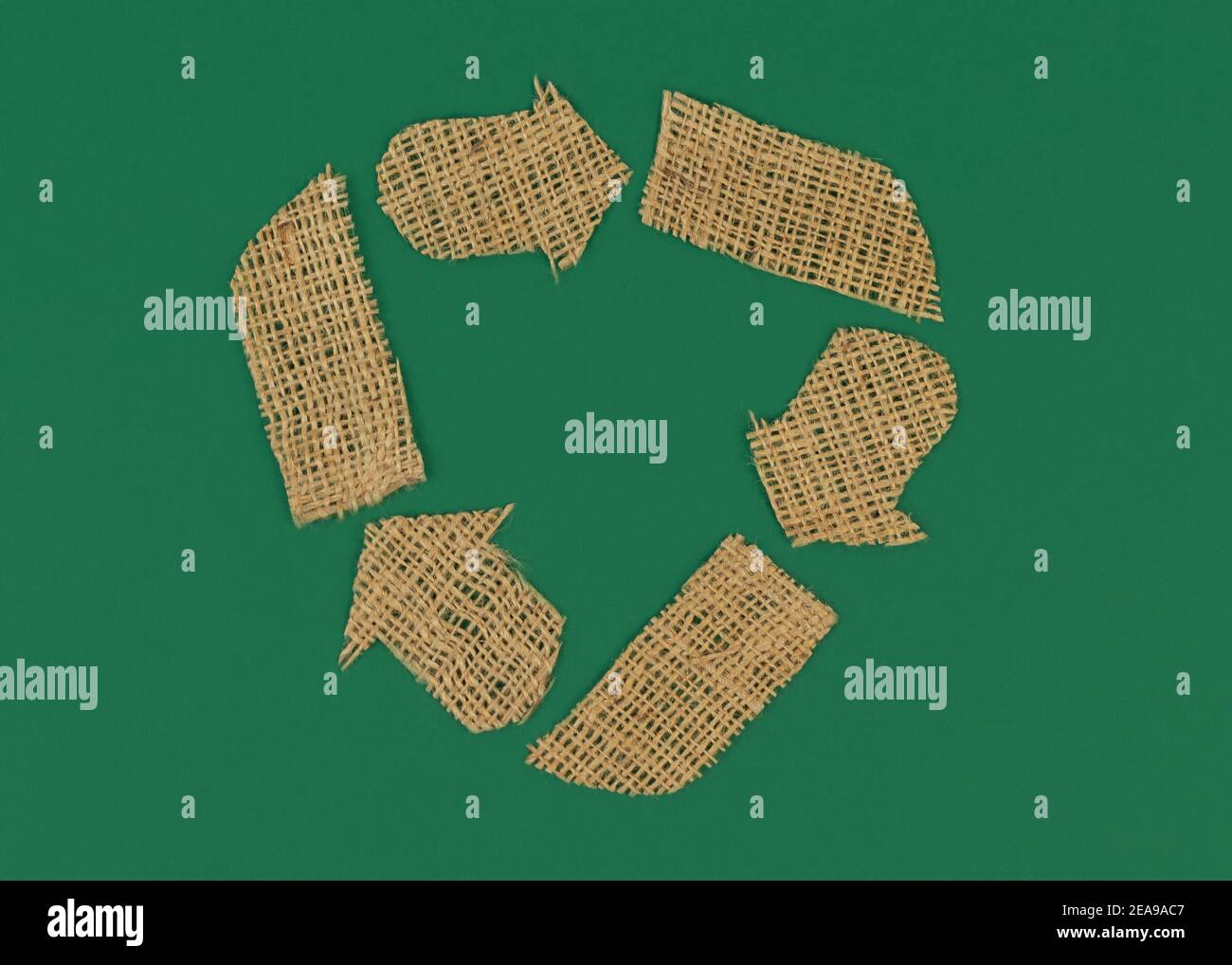 Recycling sign made of burlap on a green bac kground. Recycling and ...