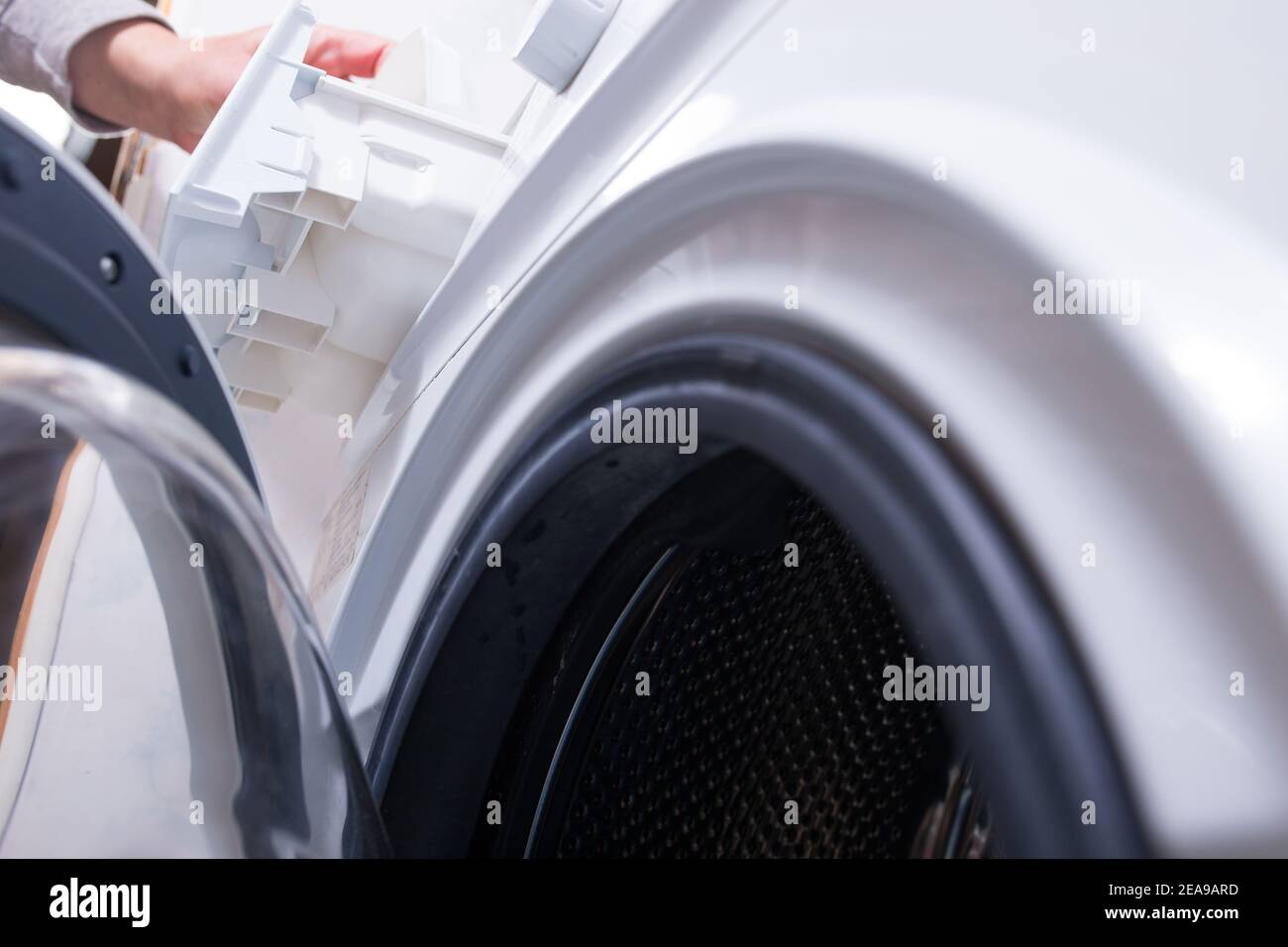 Preparing laundry to washing mashine with washing powder Stock Photo ...