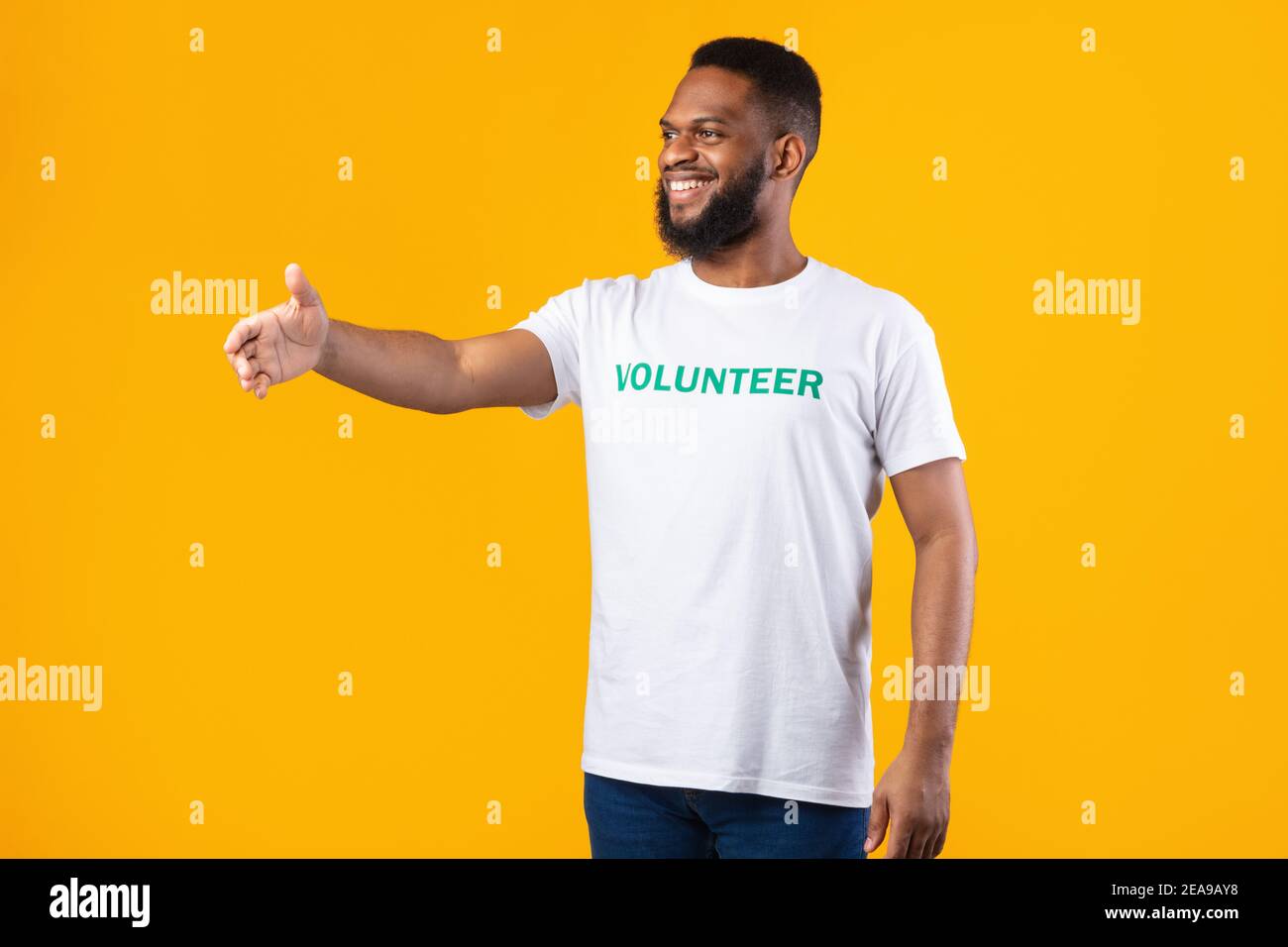 African Volunteer Man Offering Hand For Handshake, Yellow Background ...