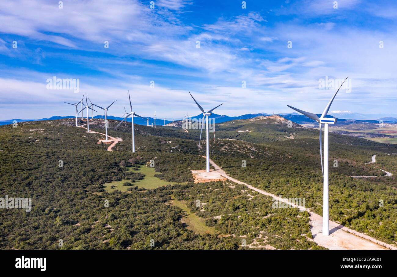 Wind turbines and curvy road on the hill, Wind farm Green ecological ...