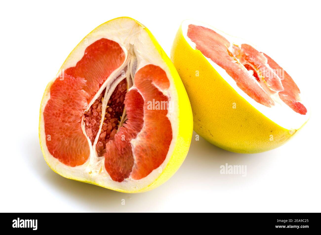 Halves of red chinese sliced pamelo on white background. Studio Photo ...