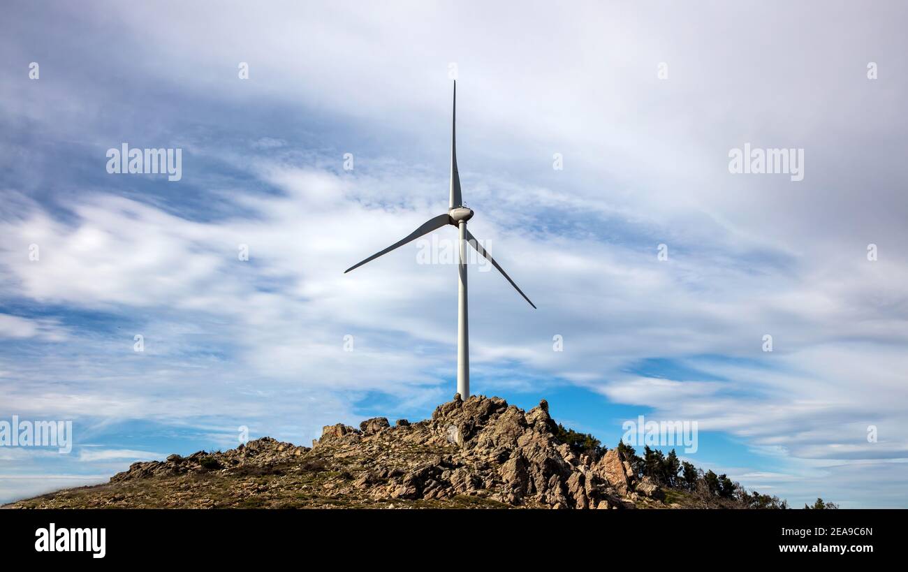 Wind turbine on the rocky hill top, aerial drone view, Alternative ...
