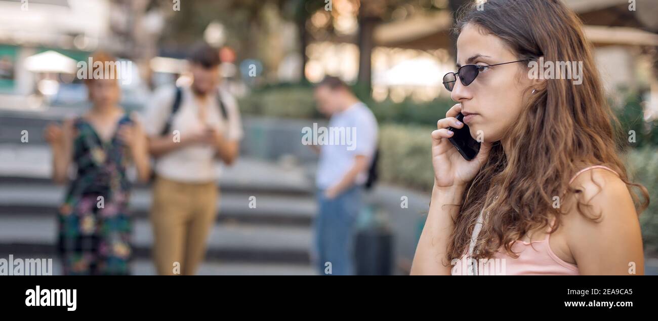 Alienation addiction. Group of friends using smartphones together ...