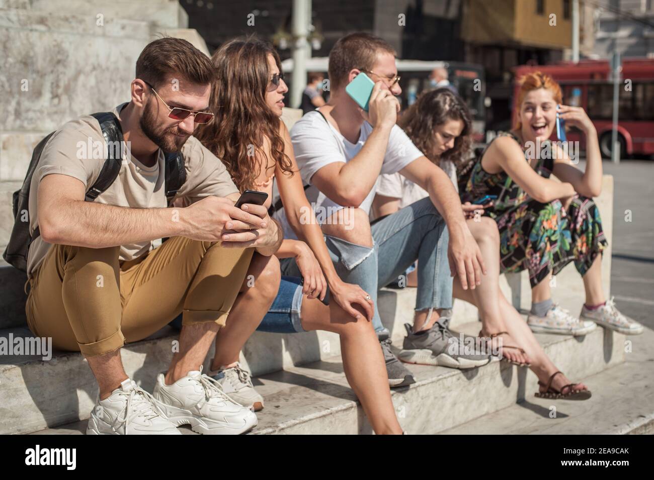 Alienation addiction. Group of friends using smartphones together ...