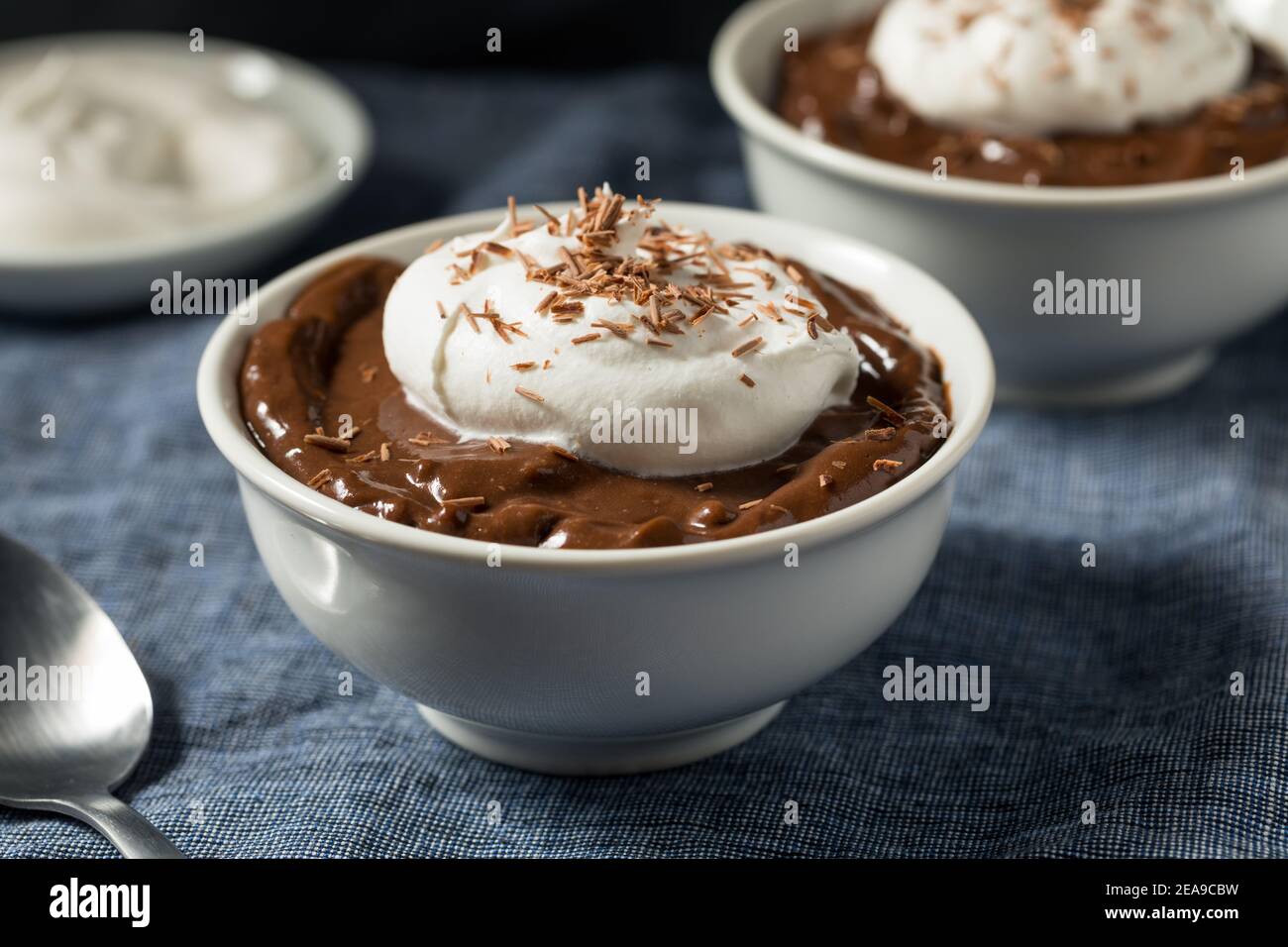 Sweet Homemade Chocolate Pudding in a Bowl with Whipped Cream Stock ...