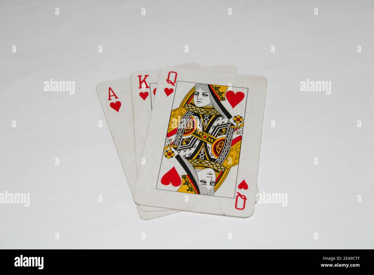 Winning playing cards on a white background Stock Photo - Alamy