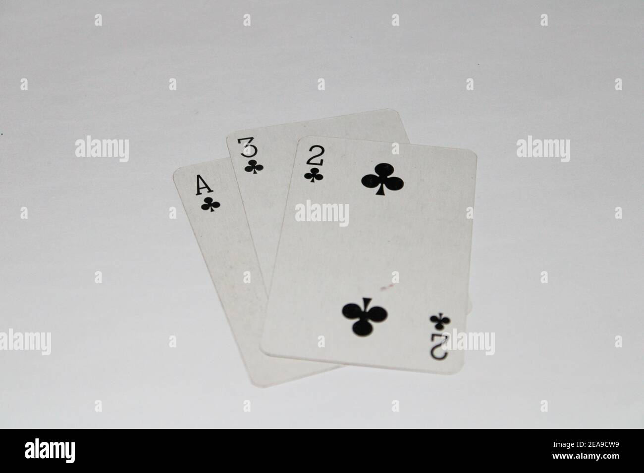 Clover playing cards on a white background Stock Photo - Alamy