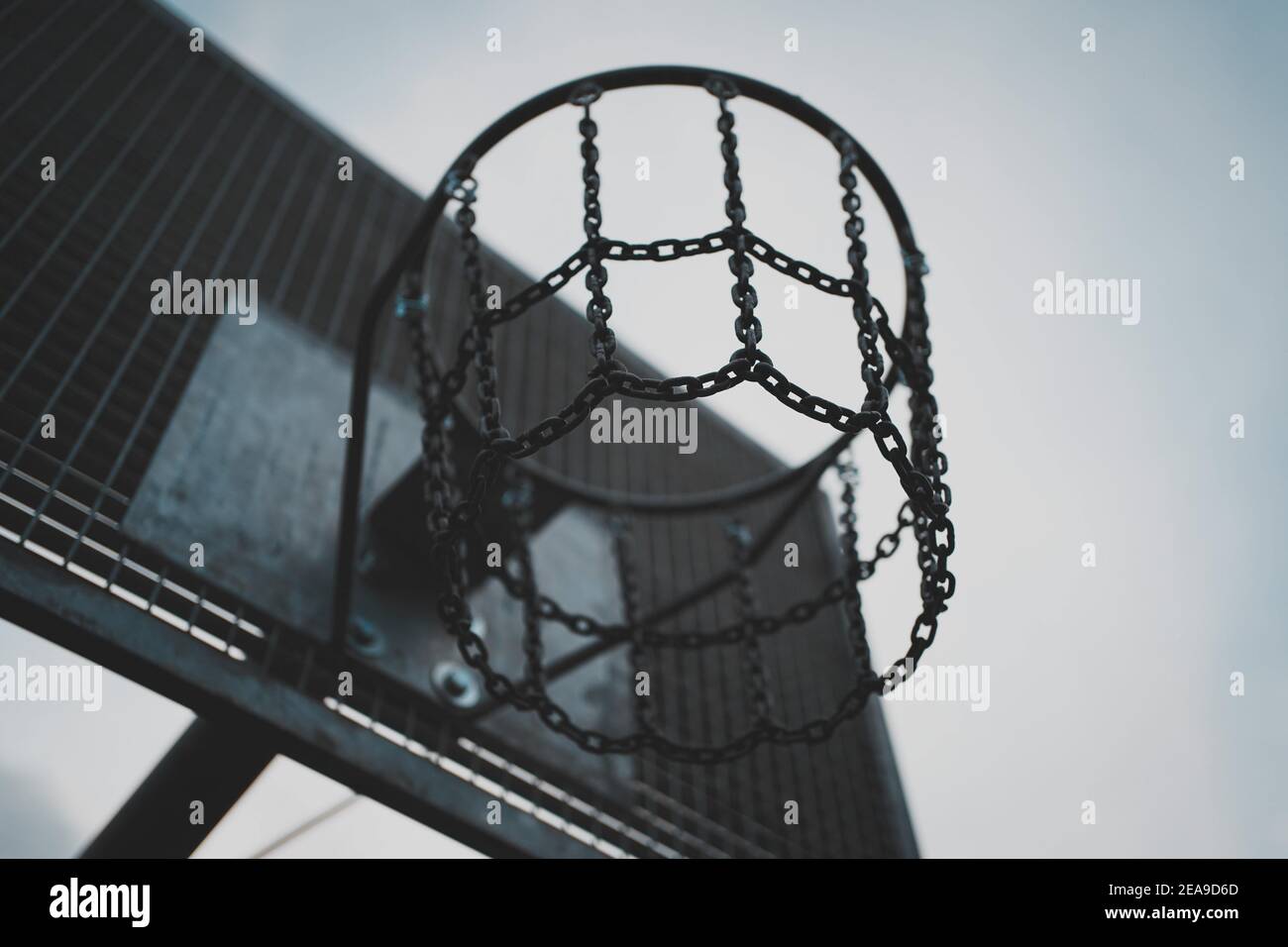 Low angle shot of an old basketball hoop with a metal net Stock Photo ...