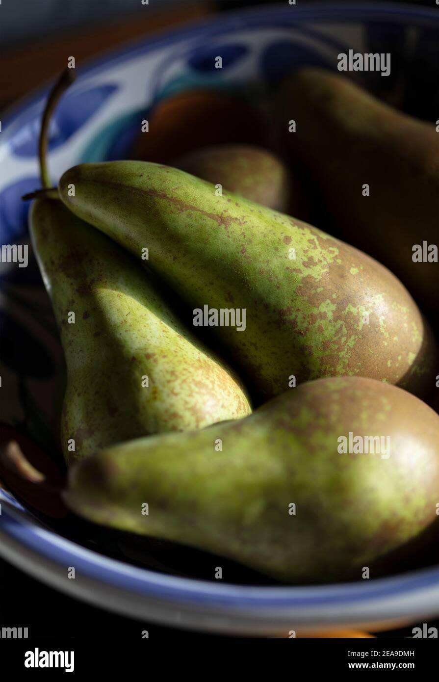 Conference Pears in blue bowl food/fruit still-life Stock Photo - Alamy