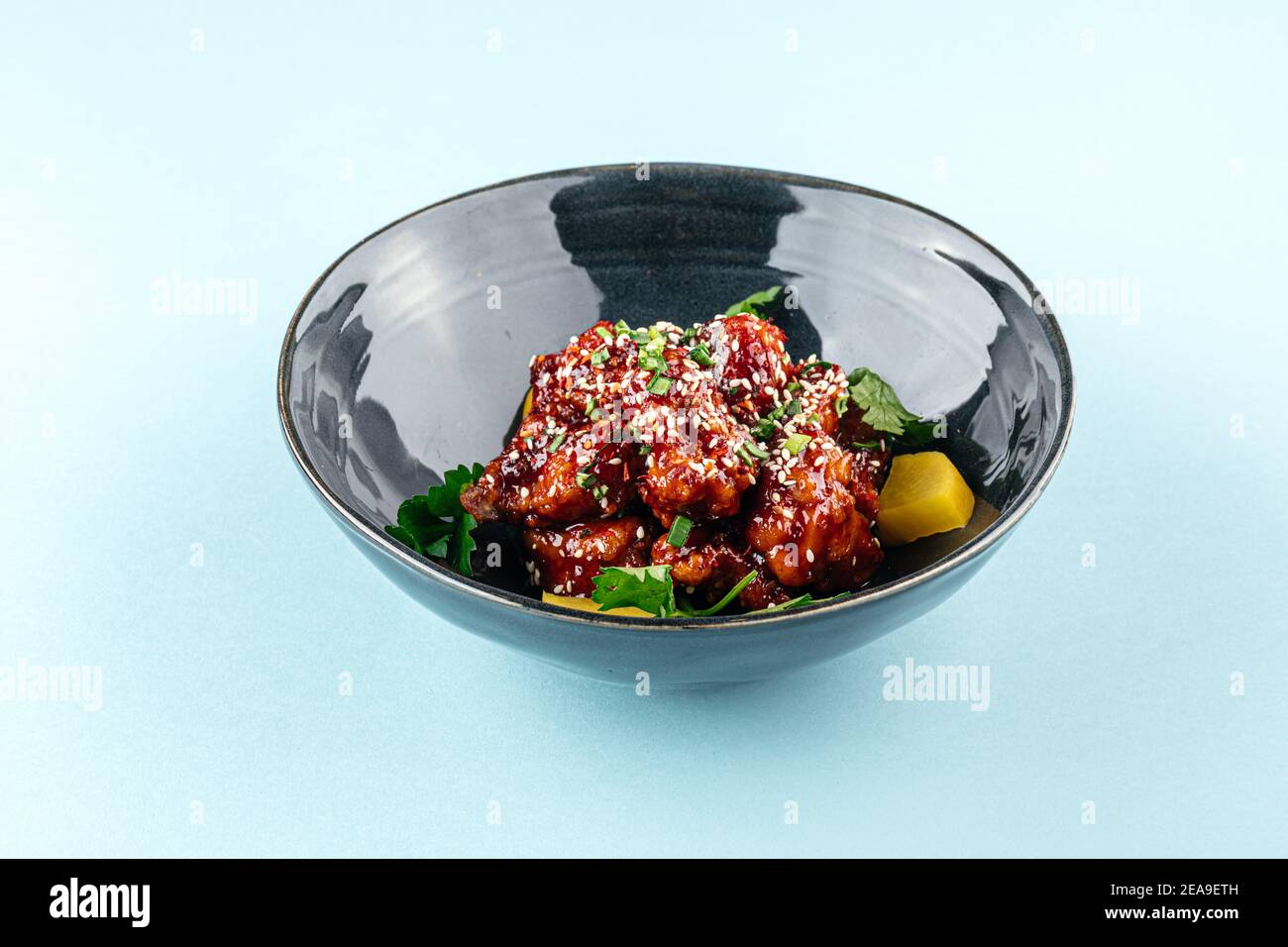 Asian marinated chicken in spicy sauce with daikon Stock Photo - Alamy