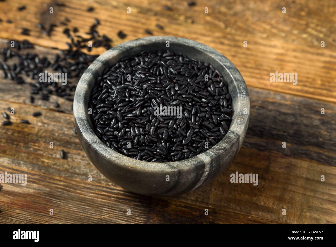 Dry Organic Asian Black Rice in a Bowl Stock Photo - Alamy
