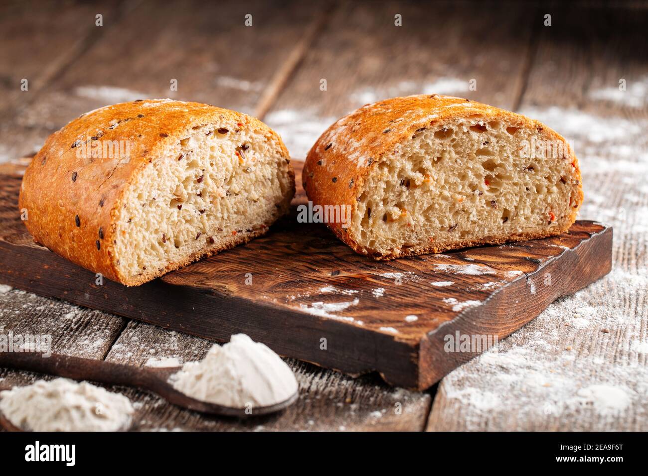 Side view on cut loaf of rustic bread with filling Stock Photo - Alamy