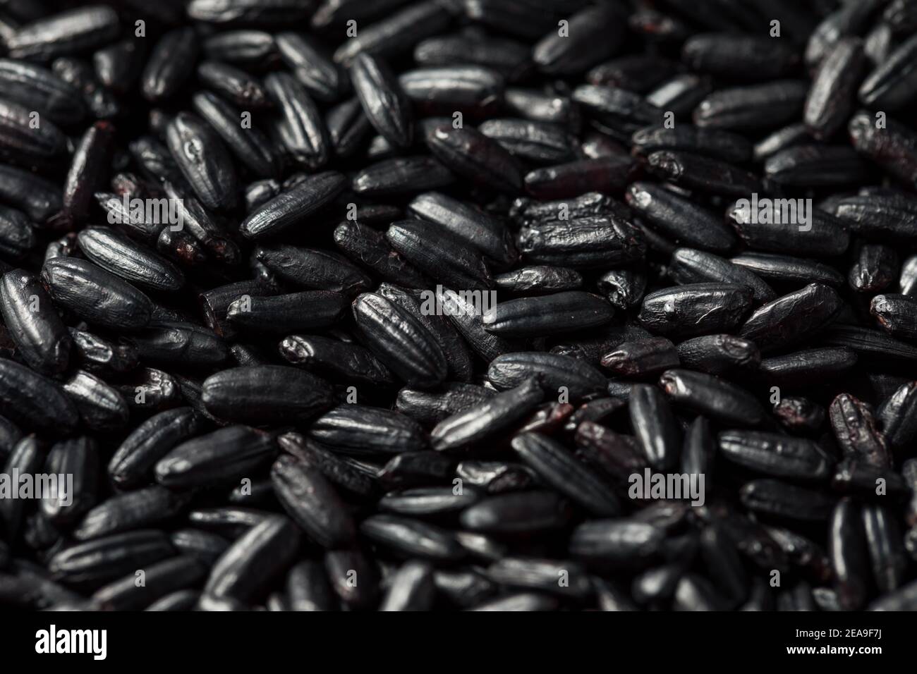 Dry Organic Asian Black Rice in a Bowl Stock Photo - Alamy